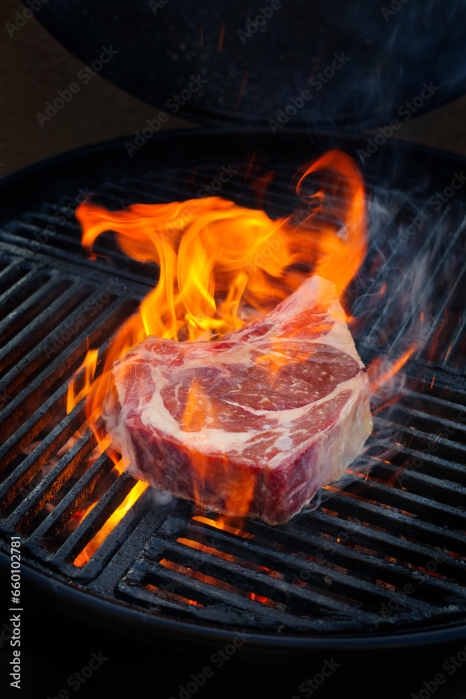Barbecue dry aged wagyu prime rib beef steak grilled as close-up on a ...