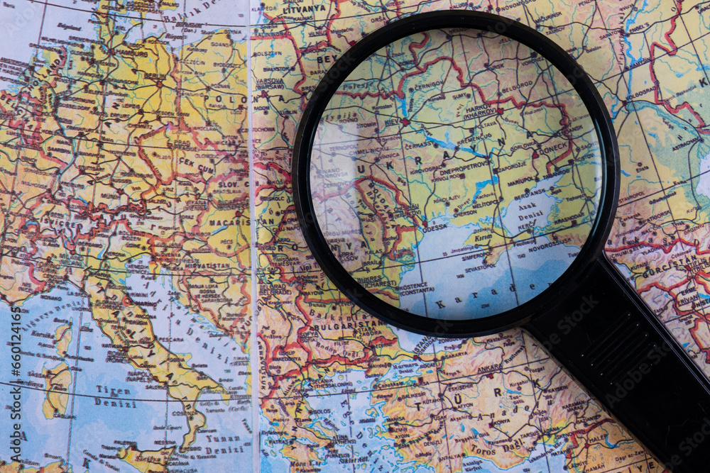 Detailed world map from black magnifying glass over Ukraine. Europe ...