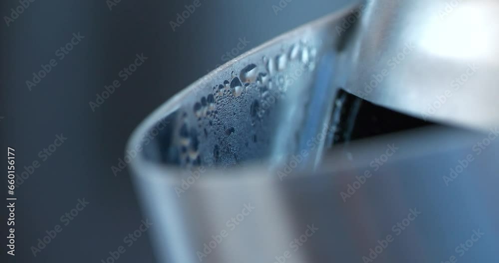 Formation of steam and condensation on the metal spout of the kettle ...