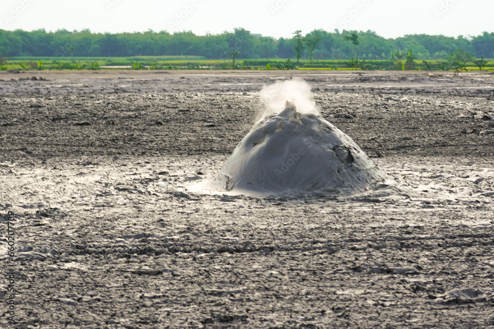 A mud volcano or mud dome is a landform created by the eruption of mud ...