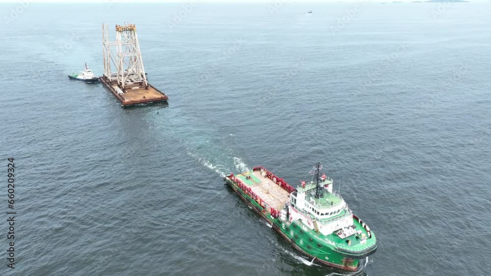Tugboat pull Big Construction on ship. Tender Drilling Oil Rig on Barge ...