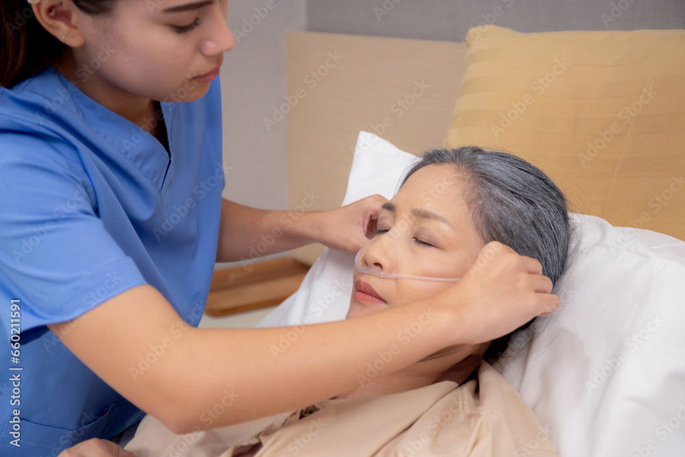 Nurse putting oxygen with patient elderly woman on bed for diagnose and ...
