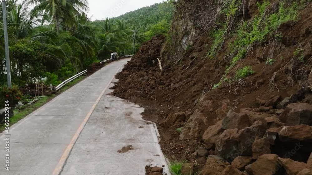 Mountain soil collapse in half of the highway. Landslides due to heavy ...