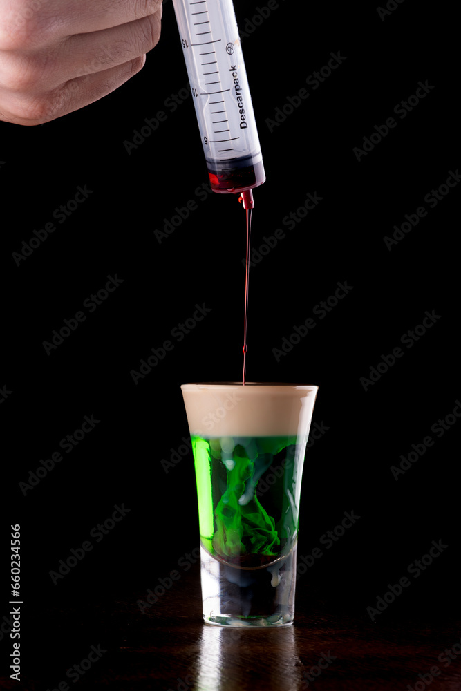 playfully pouring blood liquor into shots drink cerebral hemorrhage for ...
