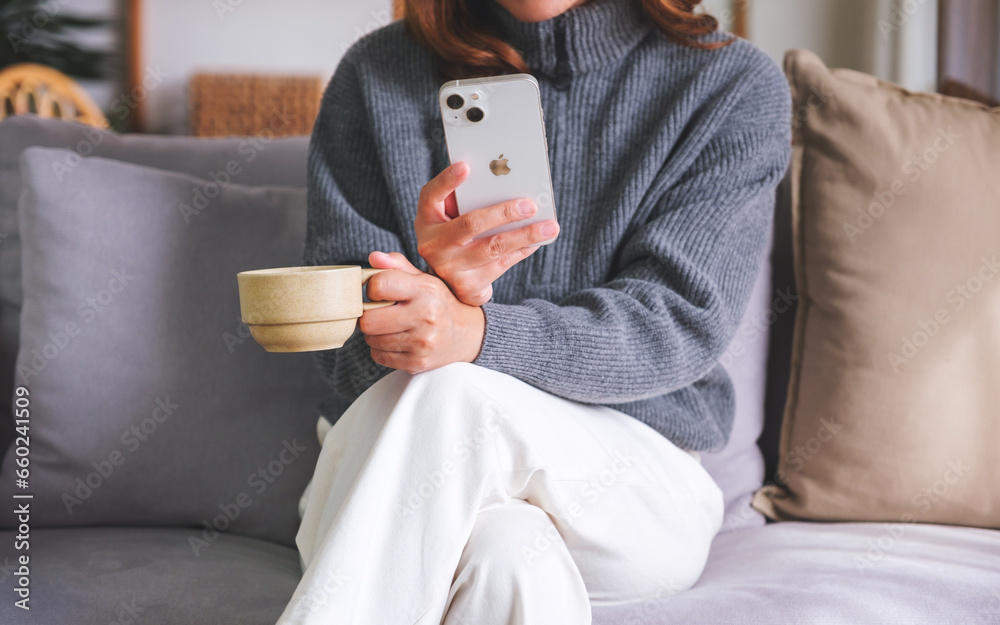 Sep 25th 2023 : A woman drinking coffee while using Iphone 13 smart ...