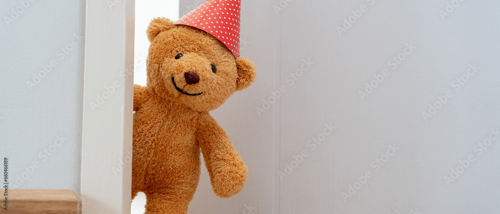 Cute brown Teddy bear toy sneak behind the door and surprise to ...