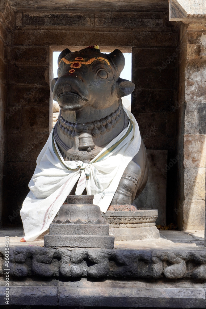 Sacred Cow statue in front of temple. Nandi statue at ancient ...