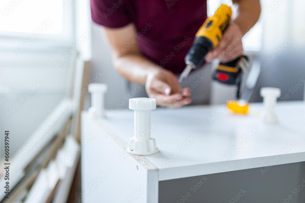 Kitchen wooden elements assembling concept. Professional carpenter ...