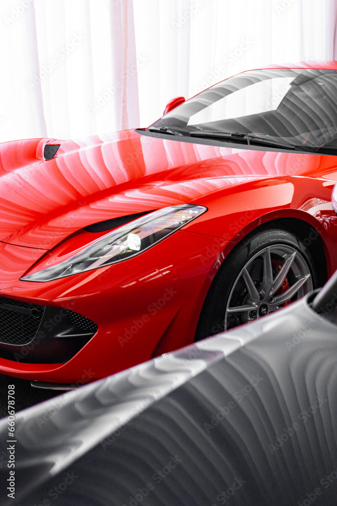 Red Ferrari 812 Superfast front end view in a showroom - High ...