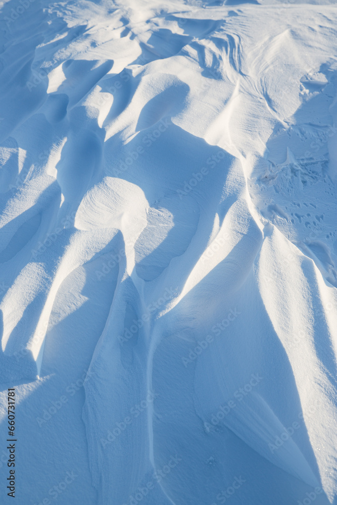 Snow texture. Wind sculpted patterns on snow surface. Wind in the ...