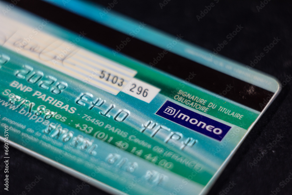 PARIS, FRANCE - MARCH 29, 2023: Selective blur on a Moneo logo and a ...