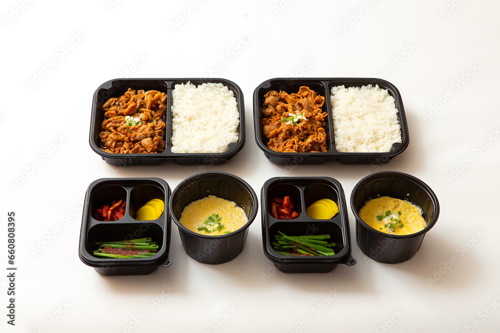 Stir-fried meat and side dishes in packaging containers, Korean food ...