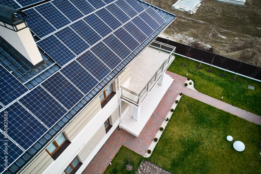 Aerial view of residential autonomous house with photovoltaic solar ...