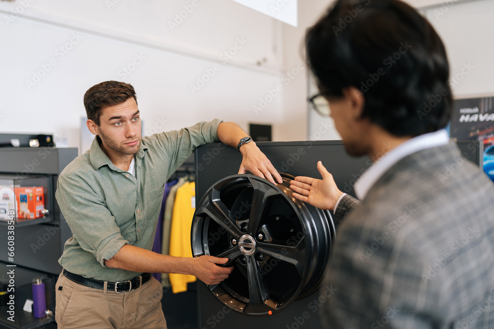 Back view of professional salesman in business suit talking about ...