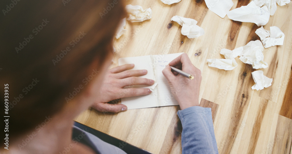Woman writing a dear John letter with crumpled pages around her Stock ...