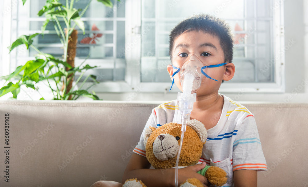 Asian Child using nebulizer mask equipment alone have smoke, Kid boy ...