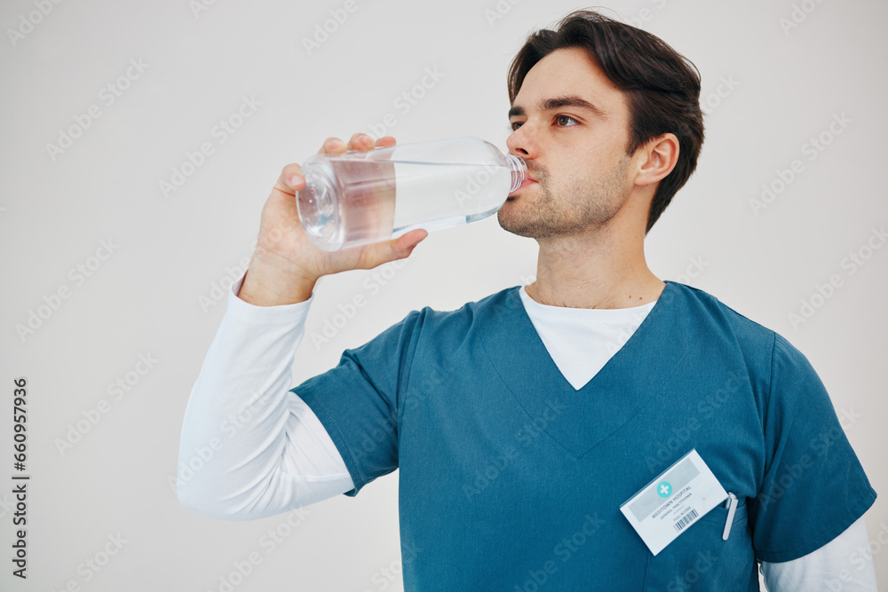 Surgeon, man drinking water in bottle and health, wellness or body ...