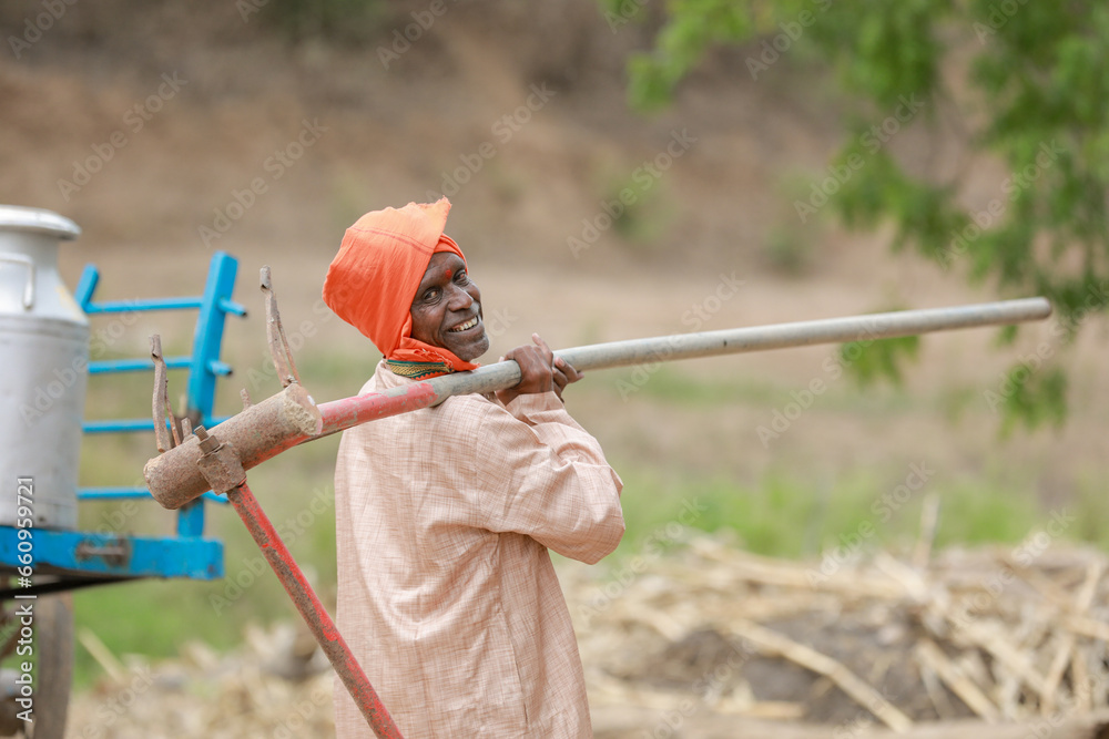 Indian farmer and a yoke of oxen farming in India Stock Photo | Adobe Stock