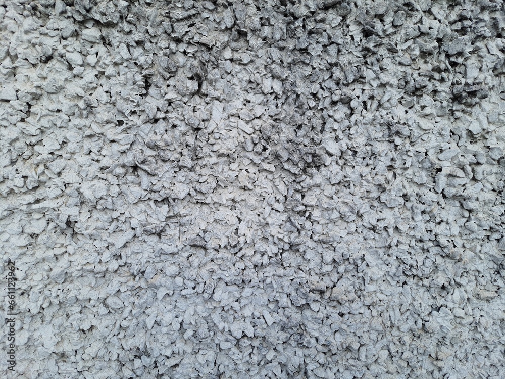 Rough concrete wall made of exposed aggregate pebbles and cement.Front ...