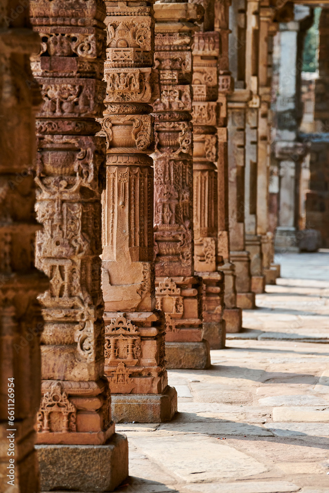 Stone columns with decorative bas relief of Qutb complex in South Delhi ...