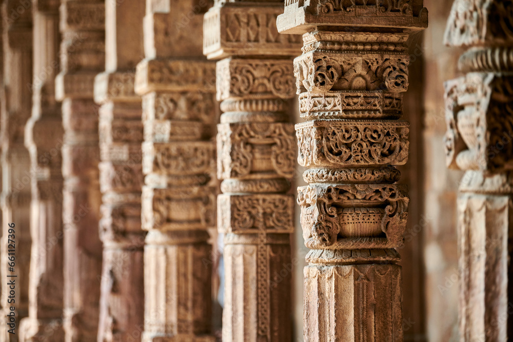 Stone columns with decorative bas relief of Qutb complex in South Delhi ...