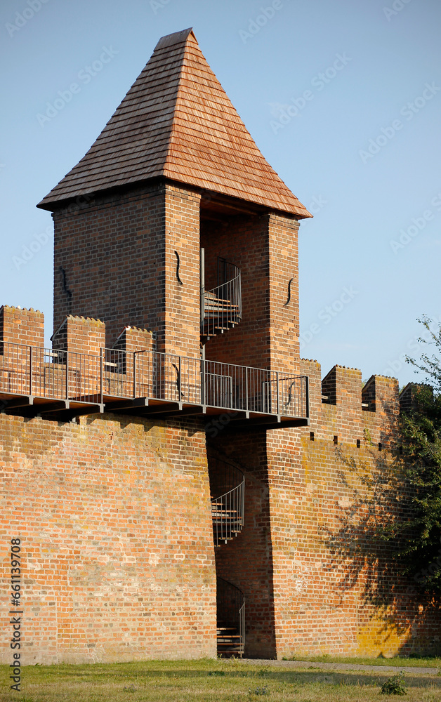 Medieval brick fortification with battlement and watch tower of the ...