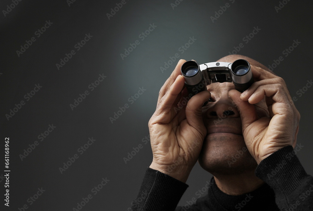 man looking through binoculars look ahead for the future with people ...