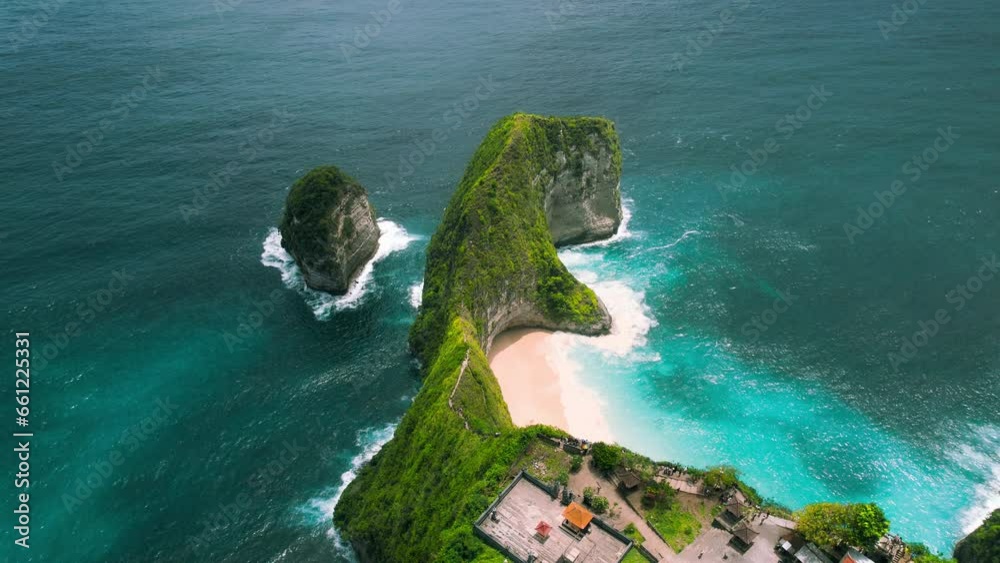 Tropical rocky coastline. Tourists descend along a dangerous mountain ...
