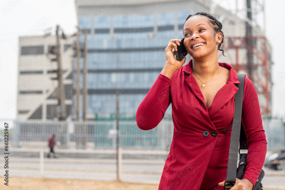 beautiful young black lady making a phone call Stock Photo | Adobe Stock