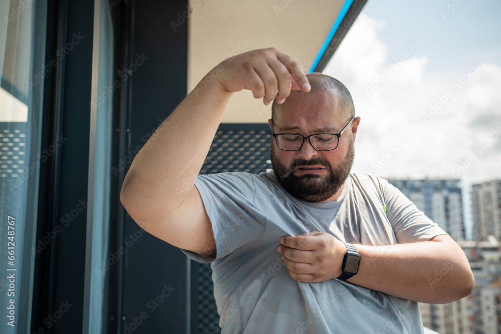 Man with wet armpits and disgusted expression on face. Fat obese young ...