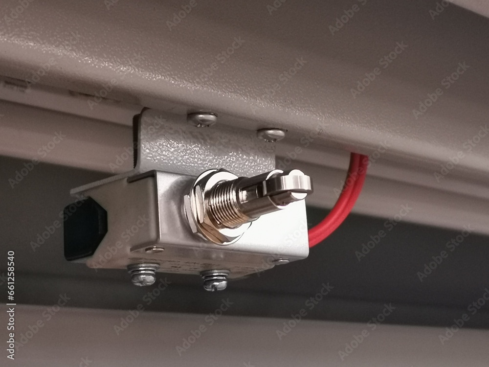 Image of limit switch attached to metal cabinet door to detect ...