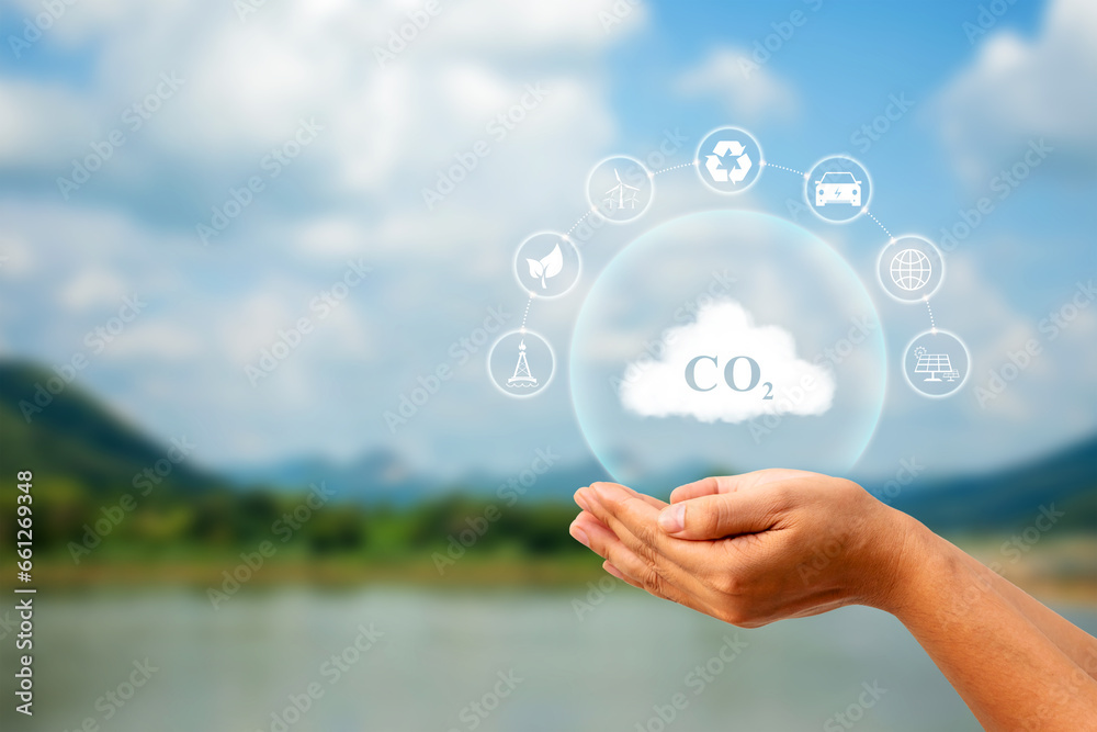CO2 symbol on a cloud in a human hand regarding the issue of carbon ...