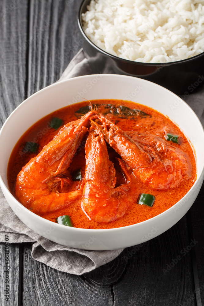 Chingri Macher Malai Curry is a traditional Bengali cooked with sauteed ...