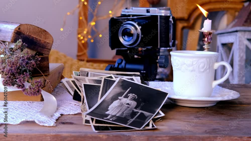 candle burning, old family photos in vintage interior, stack nostalgic ...