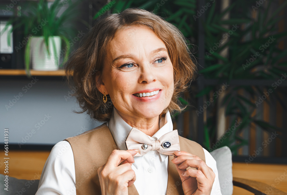 Confident stylish mature middle aged elderly business woman in suit ...