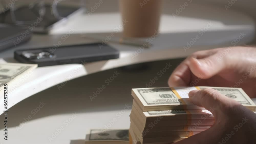 Male hands counting dollar banknotes sitting in room at table. Banking ...