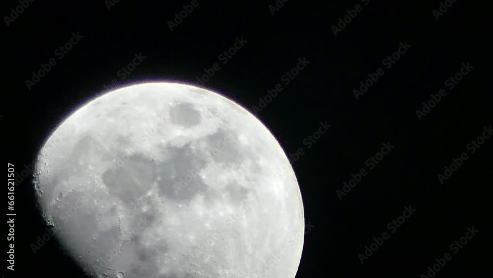 Dark night sky and silver Moon with visible craters - timelapse. Phase ...