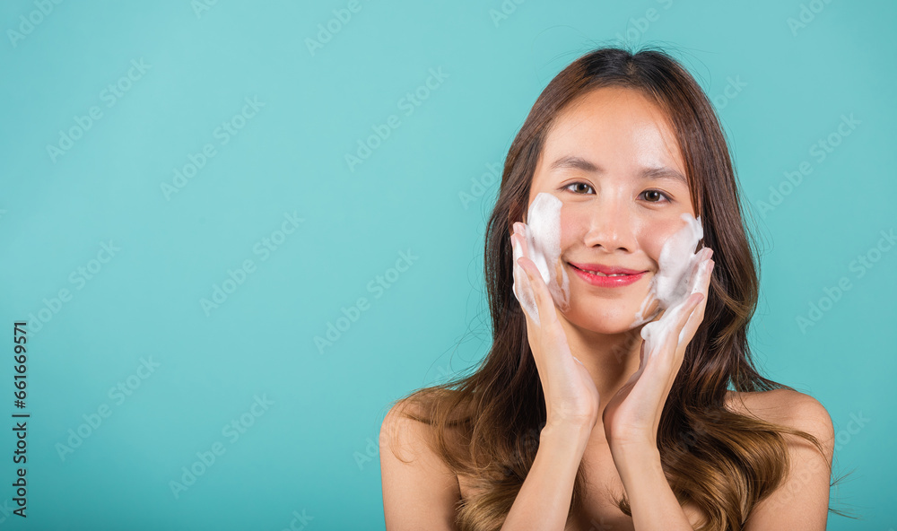 Portrait beautiful female smile applies foaming cleanser healthy skin, Asian women face wash ...