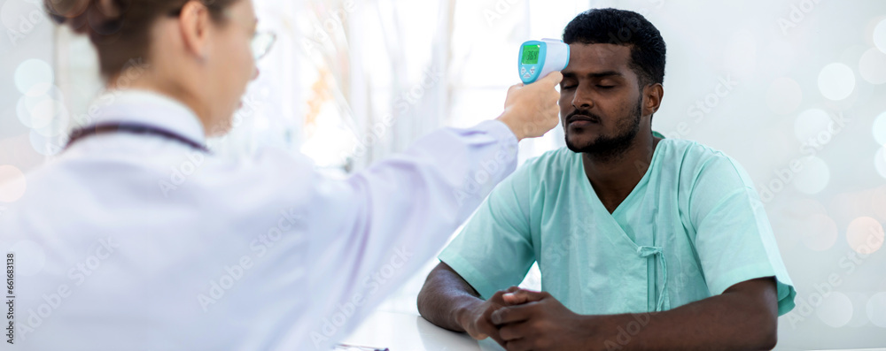 Doctor checking patient's temperature screening to patient inside the ...