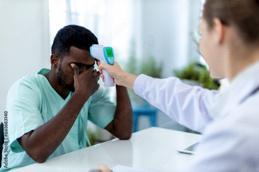 Doctor checking patient's temperature screening to patient inside the ...
