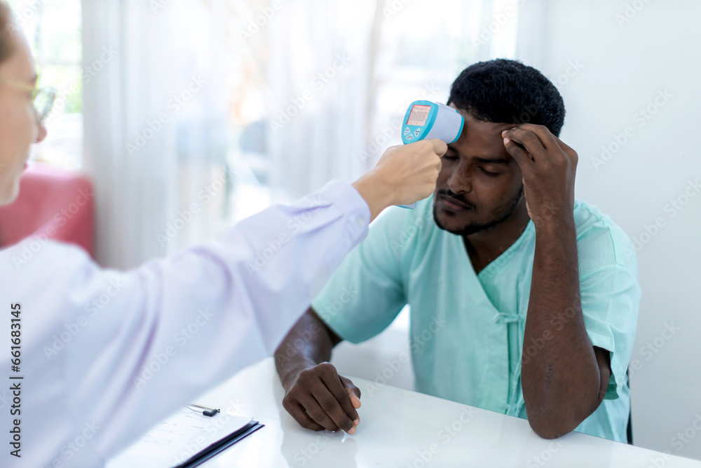Doctor checking patient's temperature screening to patient inside the ...