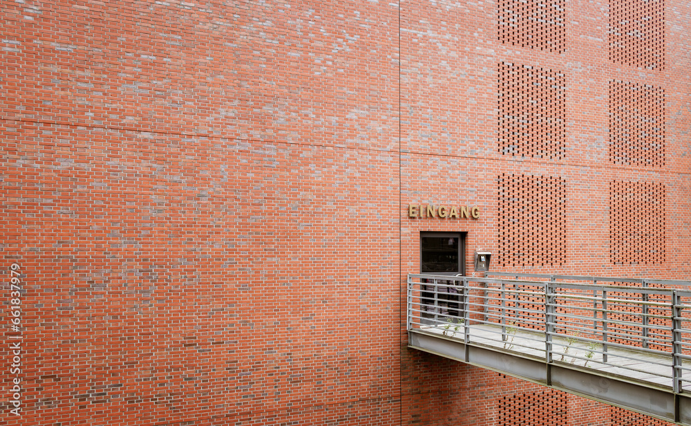 Entrance in huge brick covered facade - Wall of red clinker with ...