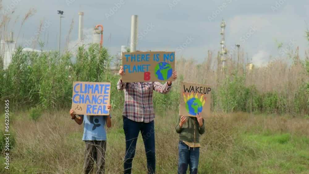 Vídeo do Stock: A protest rally in front of a smoke-belching factory ...