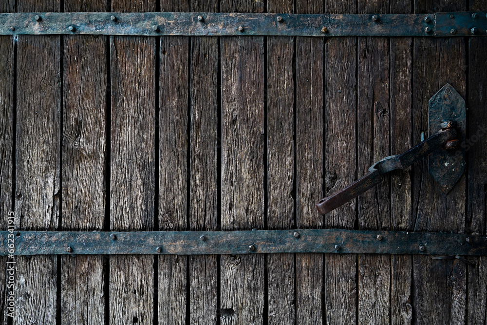Old rotten wormy ancient oak door and metal parts, wooden textured ...