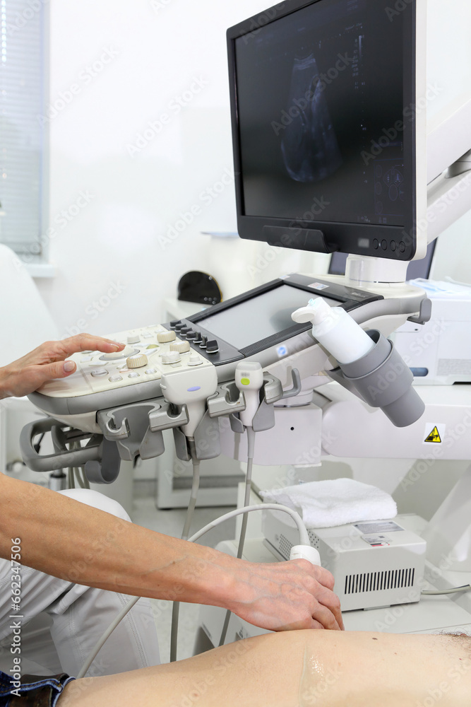 Ultrasonic examination of internal organs. A man on an abdominal ...