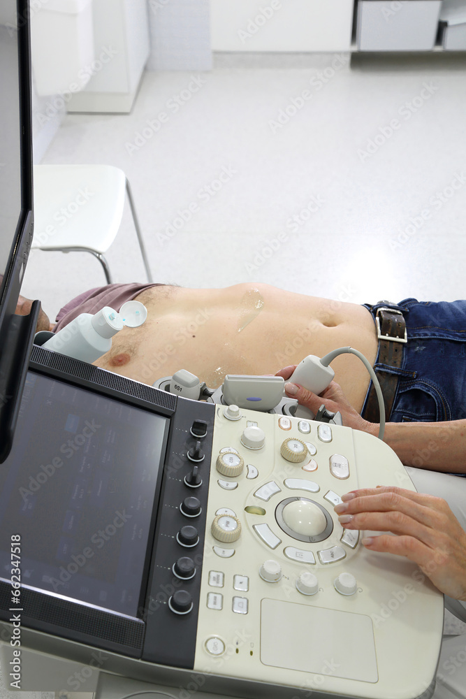 Ultrasonic examination of internal organs. A man on an abdominal ...