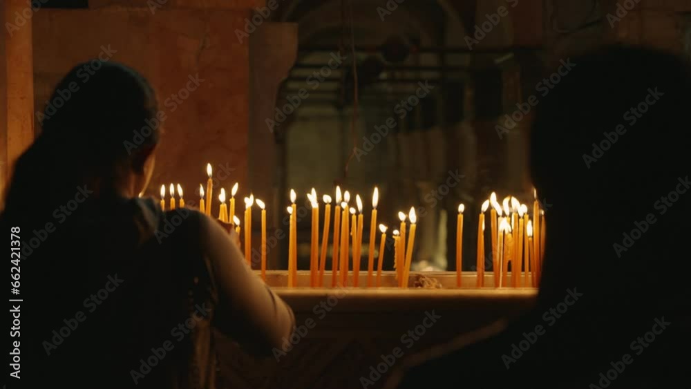 People light candles in Church of the Holy Sepulchre in Old City of ...