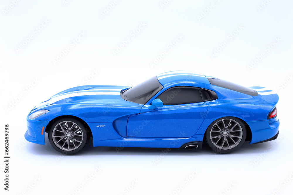 Blue toy Viper car. Side view. White background. Stock Photo | Adobe Stock