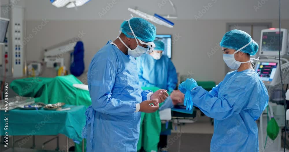 Surgeon mask, gloves and nurse help with dressing, preparation and ...