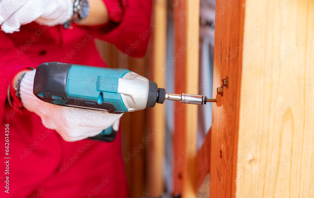 Carpenter and screwdriver hand tool. A skilled worker set to work ...